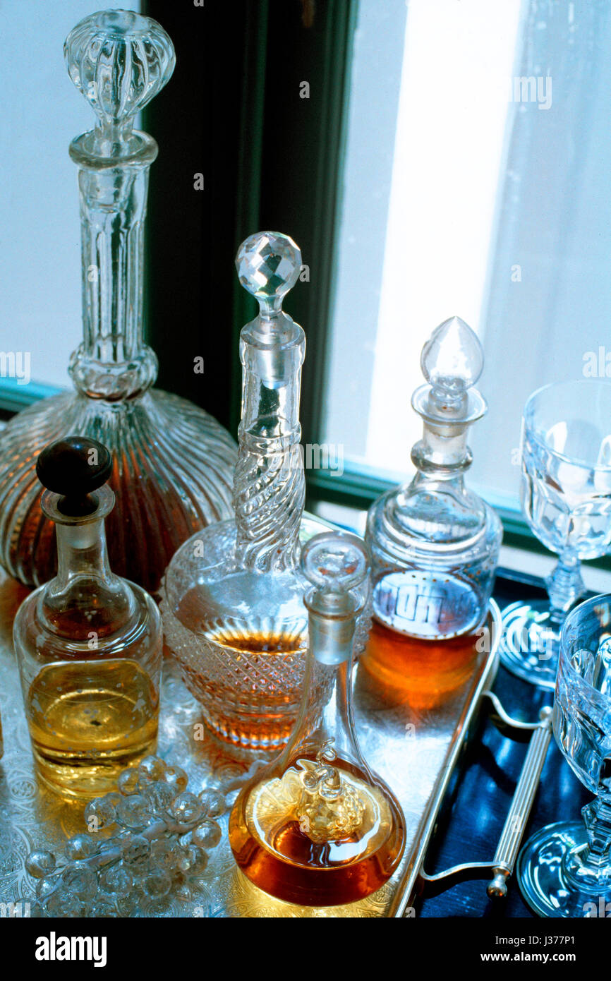 Assorted range of antique bottles with alcohol Stock Photo - Alamy