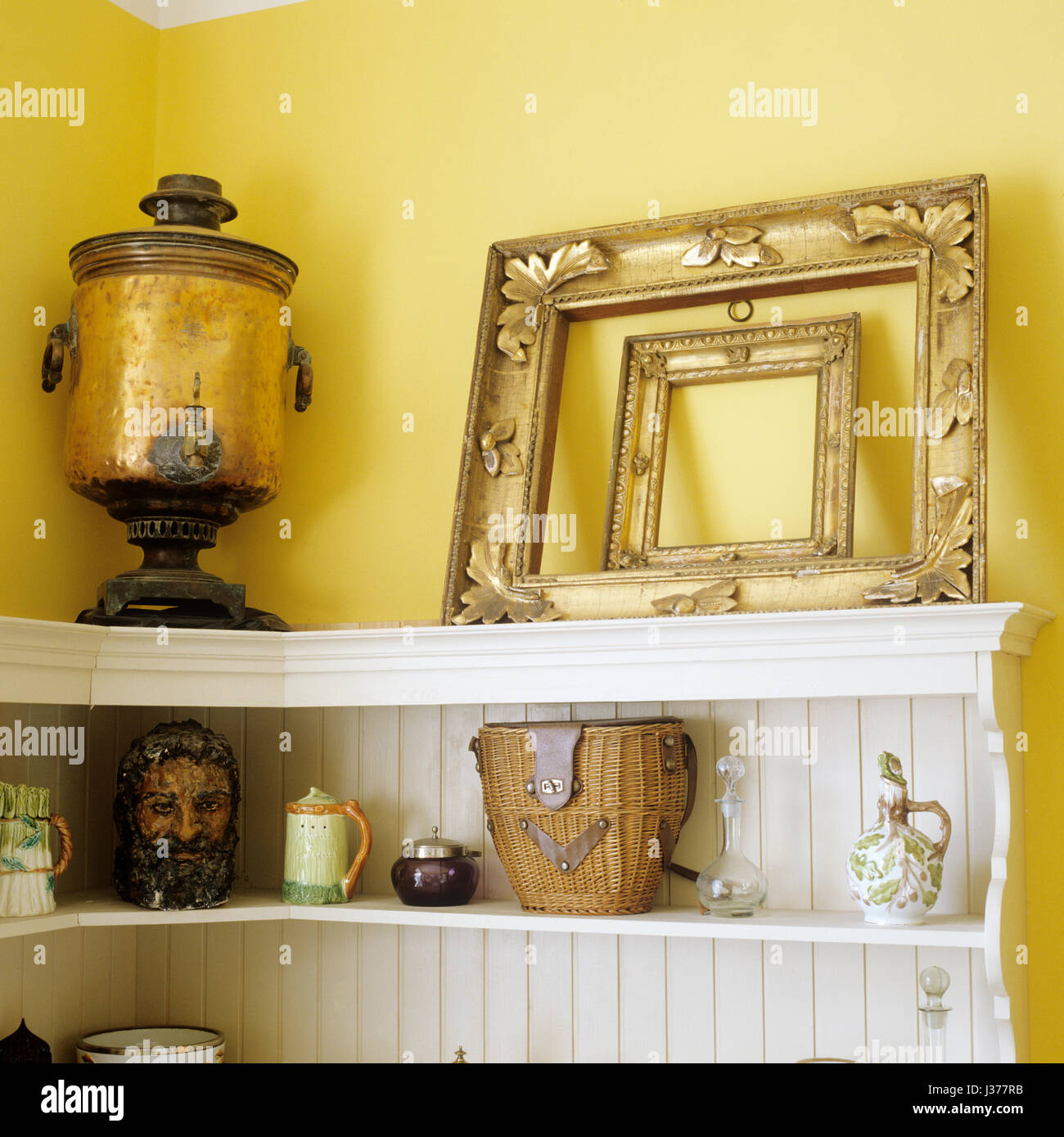 Assorted collection of antiques on shelf Stock Photo - Alamy
