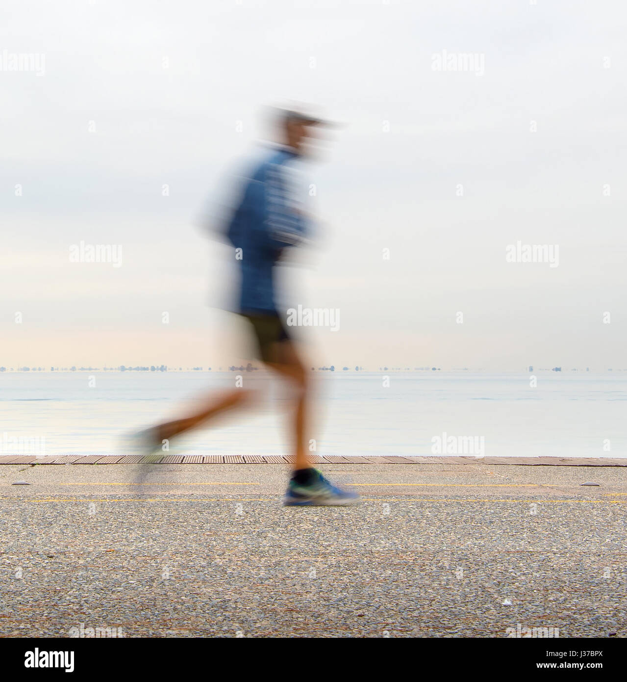 Person running hi-res stock photography and images - Alamy