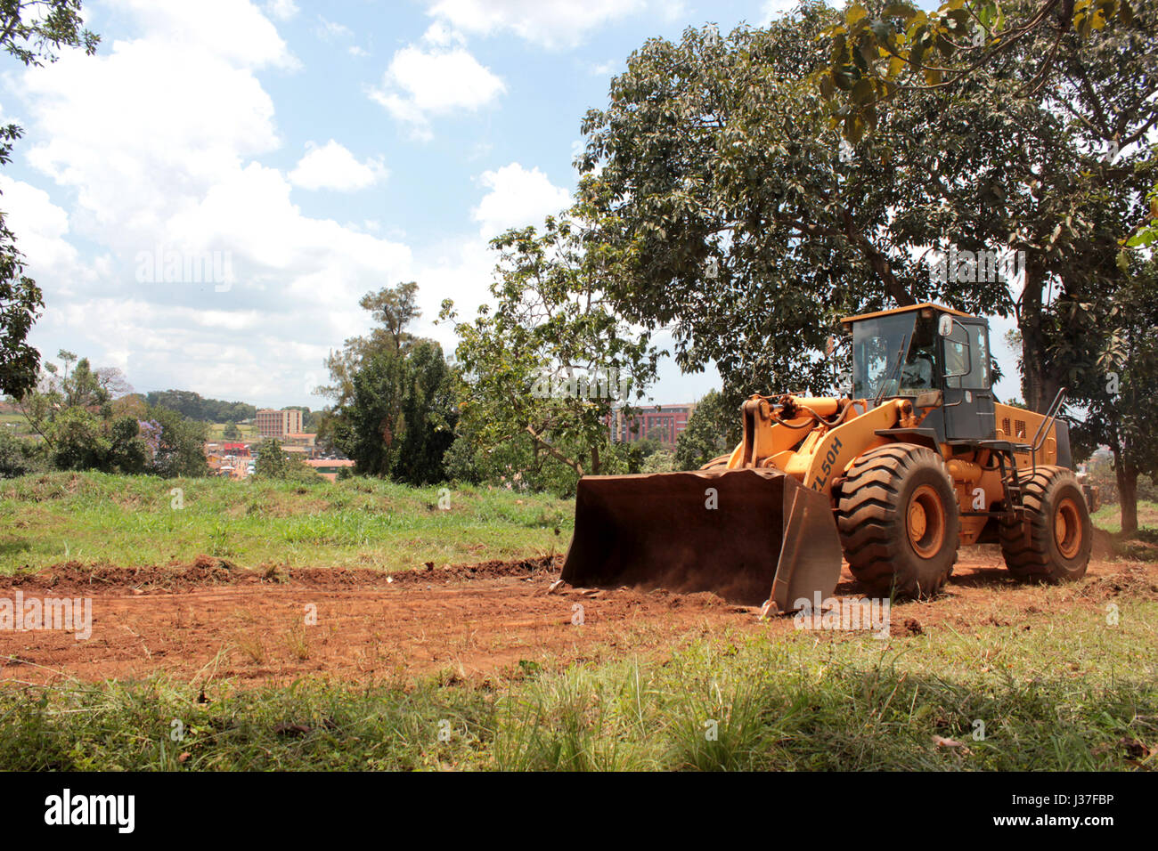 A grader at work in Kampala, Uganda Stock Photo - Alamy