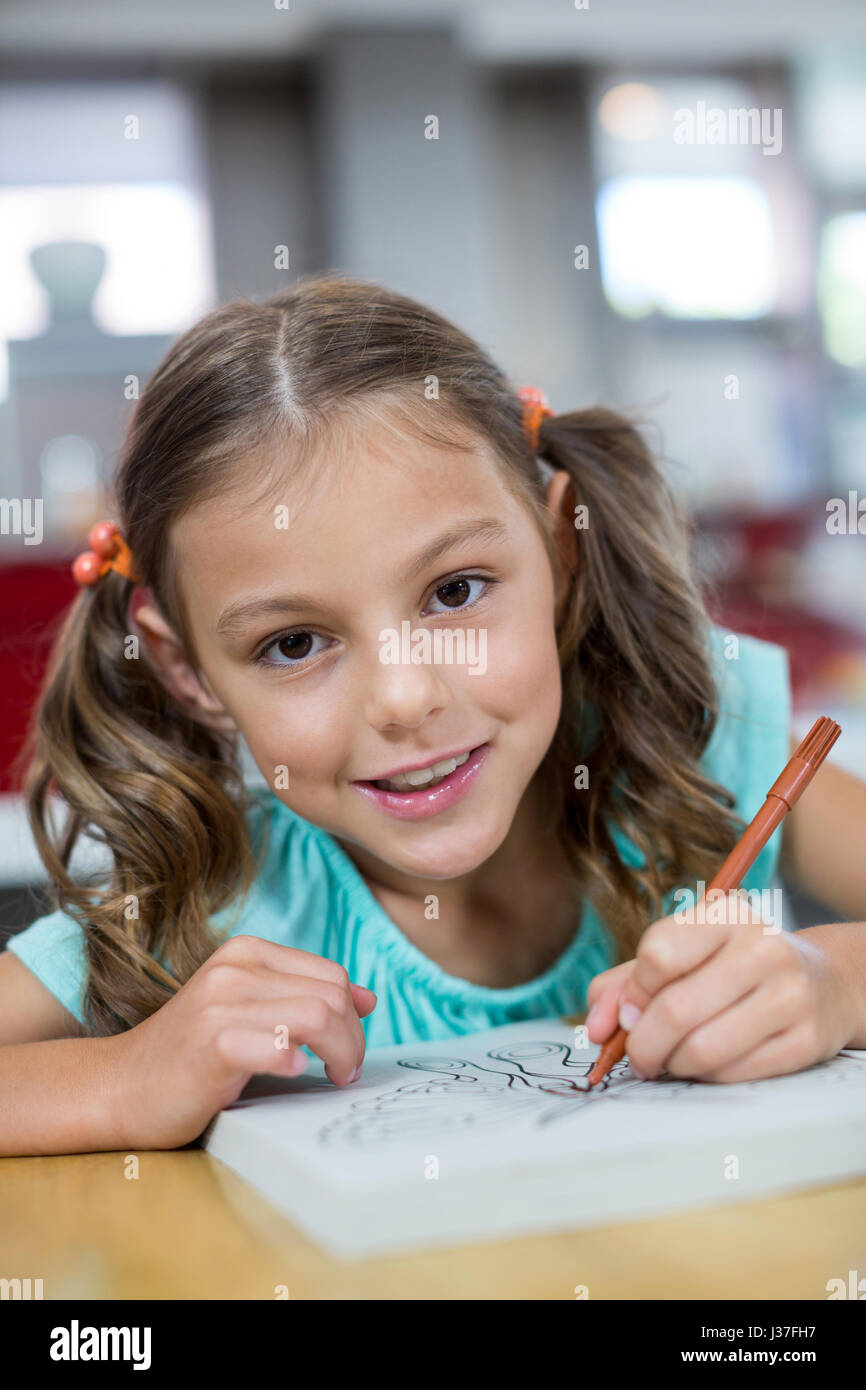 Portrait of smiling girl drawing sketch on book at home Stock Photo - Alamy