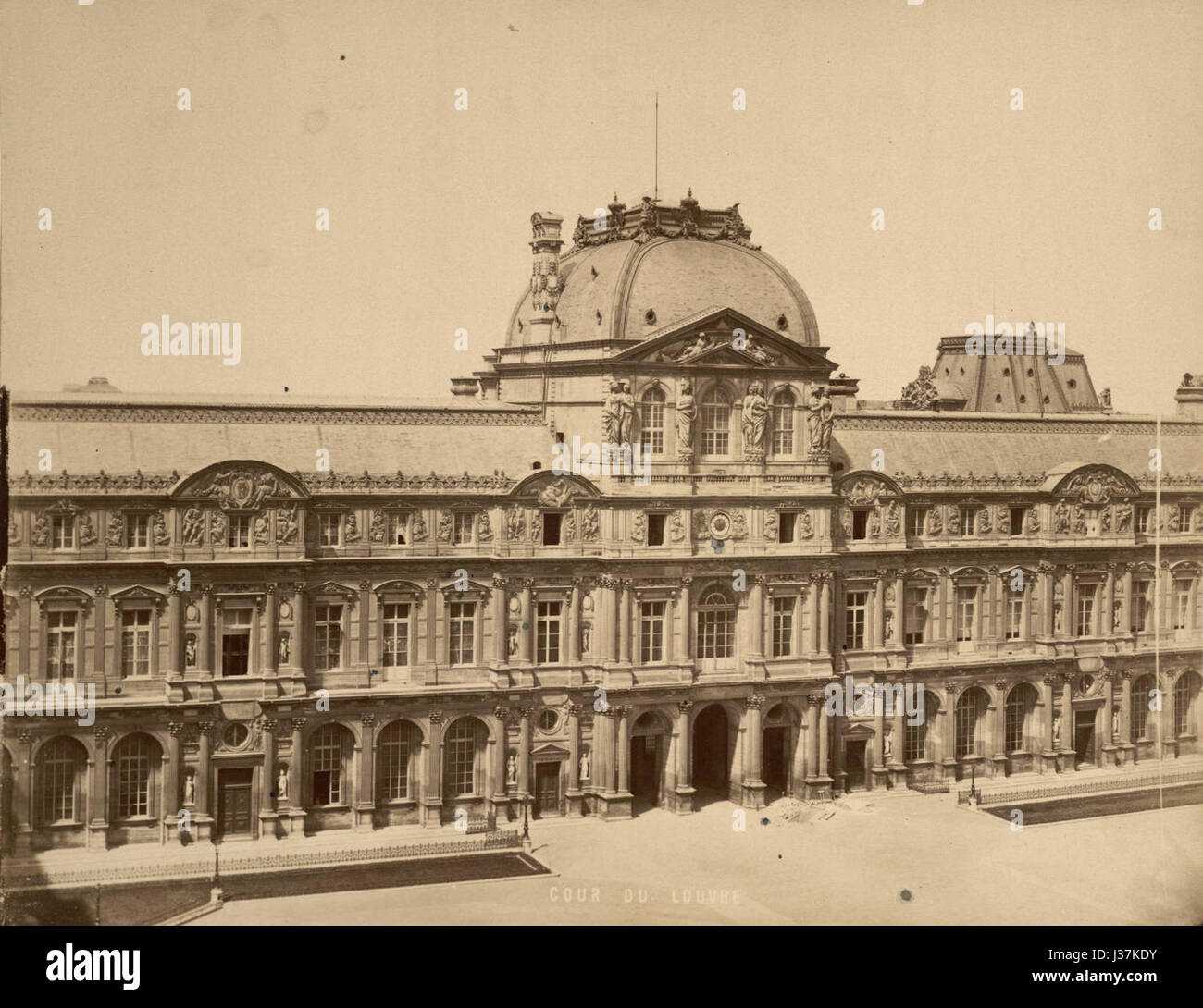 This image shows the Cour du Louvre in Paris, France, between 1865 and ...