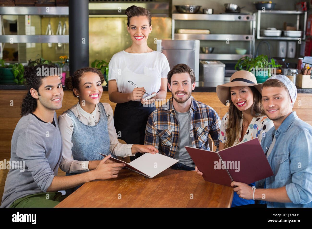 Restaurant waitress customers smile hi-res stock photography and images ...