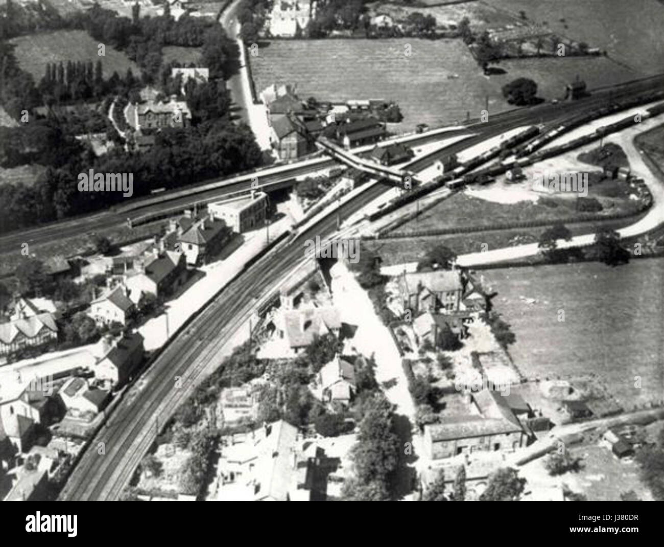 This aerial image of Cheadle Hulme Station showcases the railway ...