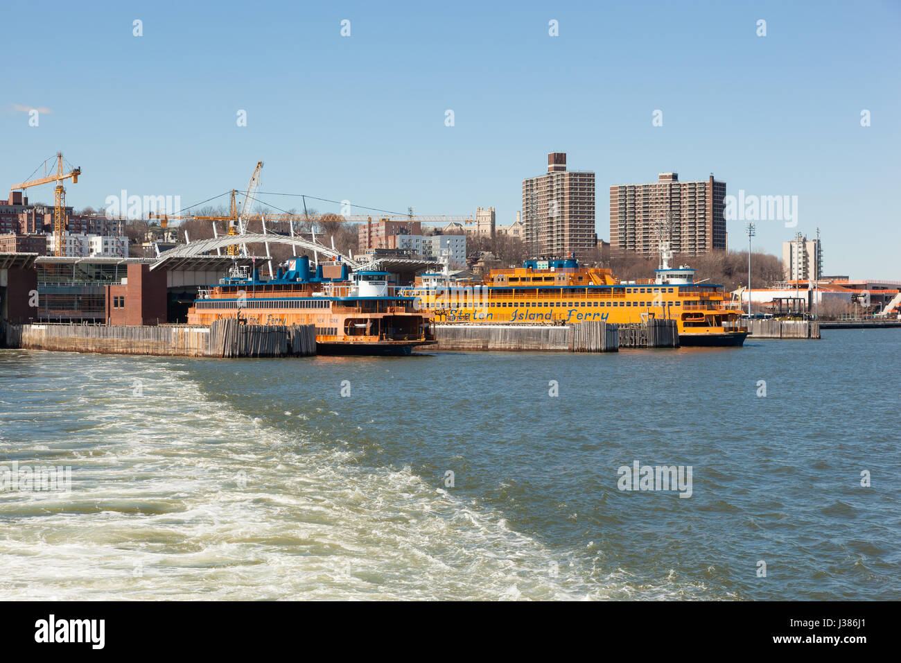 STATEN ISLAND, NEW YORK - March 29, 2017: Ferries are docked at St ...