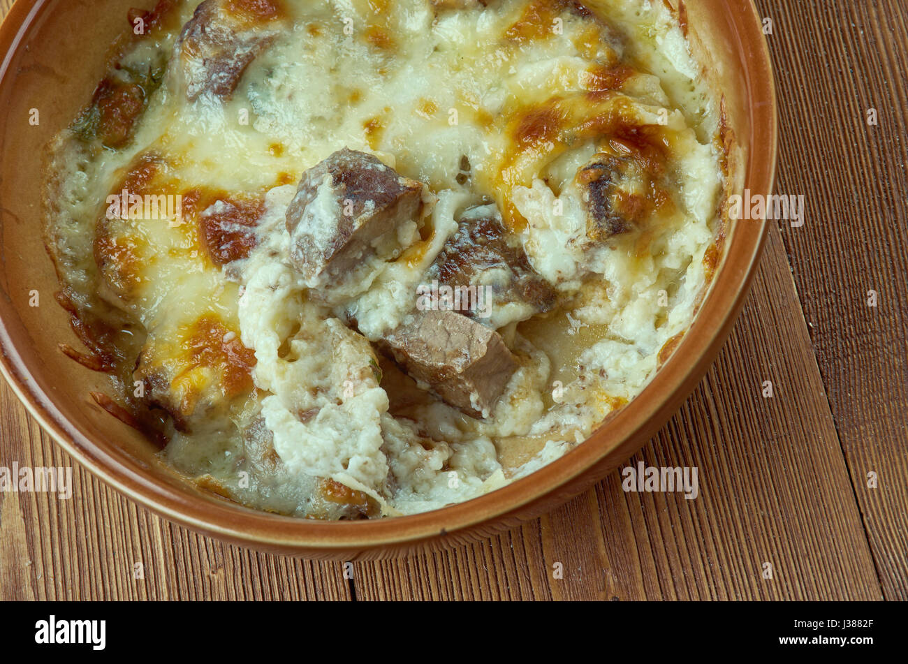 Elbasan tava - Baked lamb in yogurt.Albanian cuisine Stock Photo - Alamy