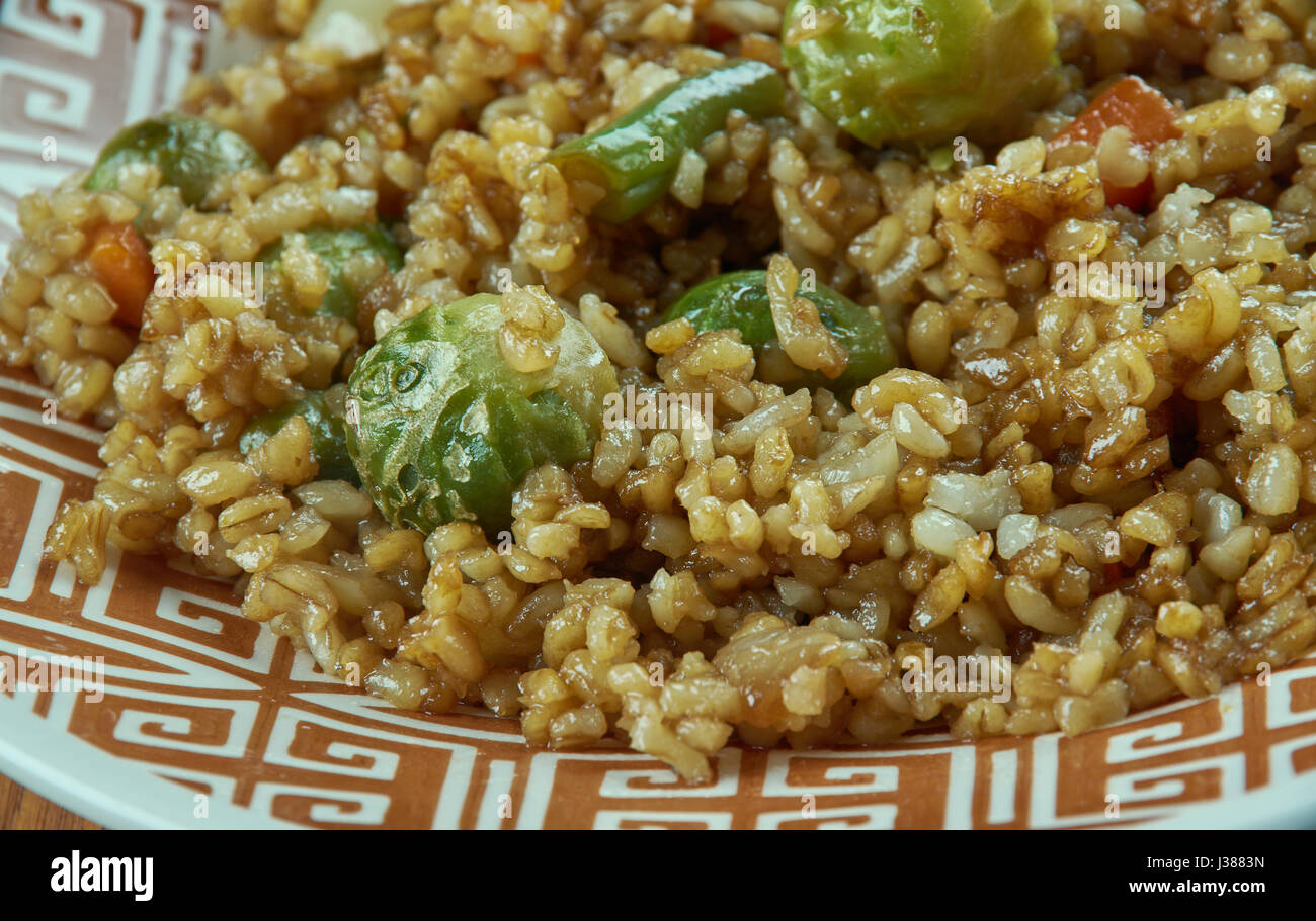 Freekeh - cereal food made from green durum wheat,Fried with vegetables ...