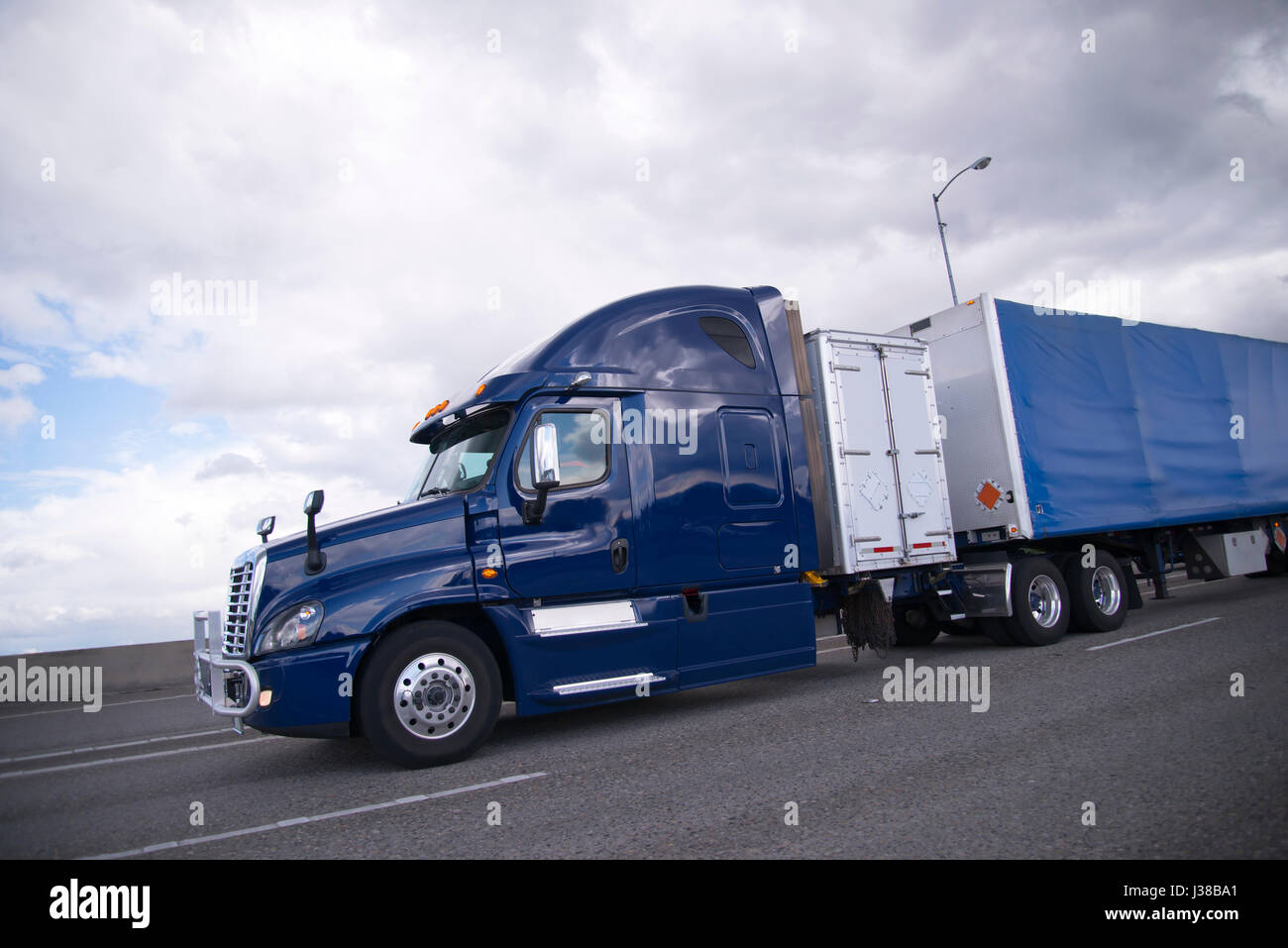 Modern mainline industrial dark blue semi truck for long distance ...