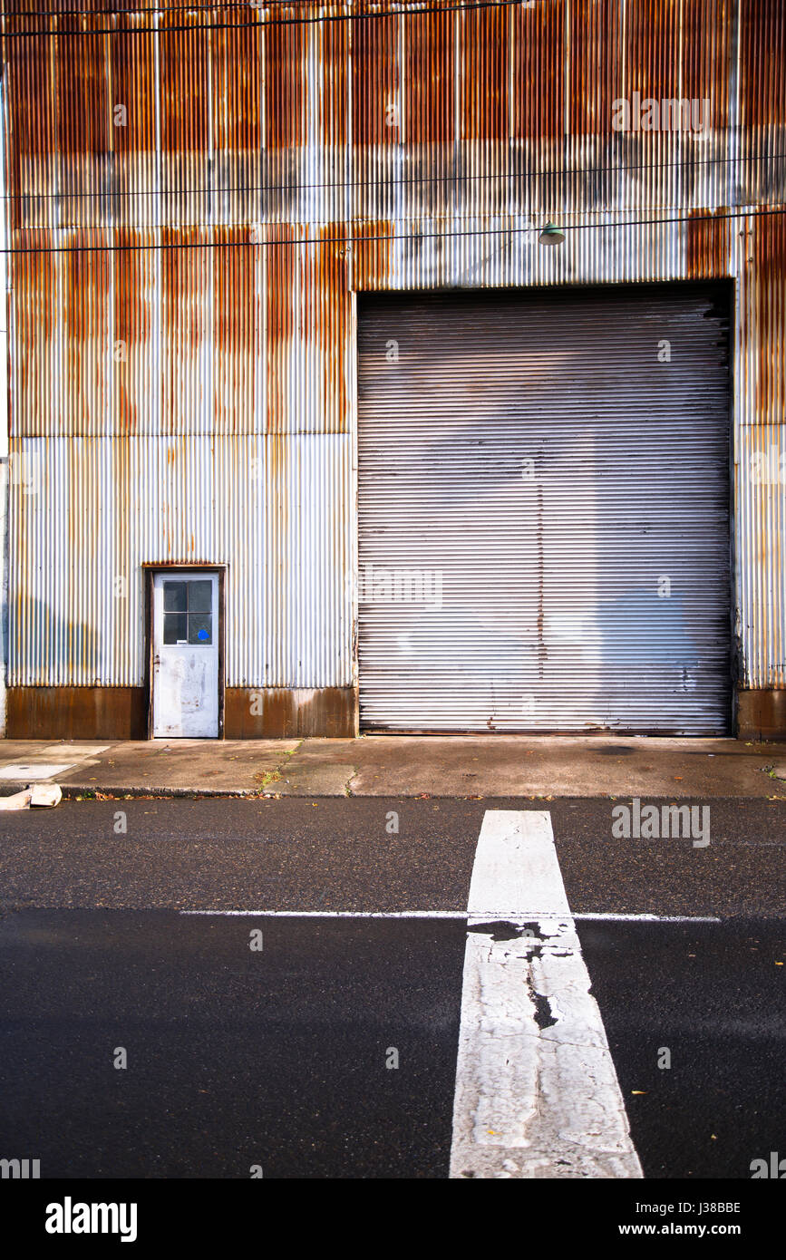 The front side of a large retro old warehouse from sheet of corrugated ...