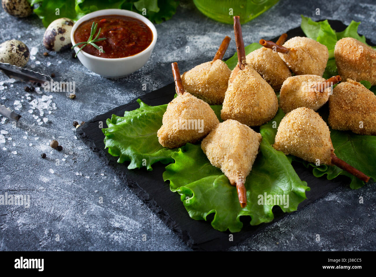 Snack spicy fried quail legs, cutlet in a batter with breaded on the ...