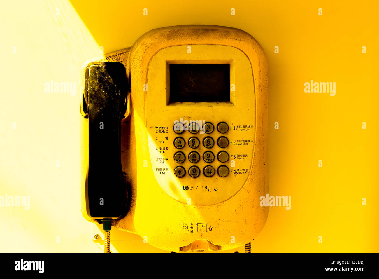 Yellow telephone box hi-res stock photography and images - Alamy