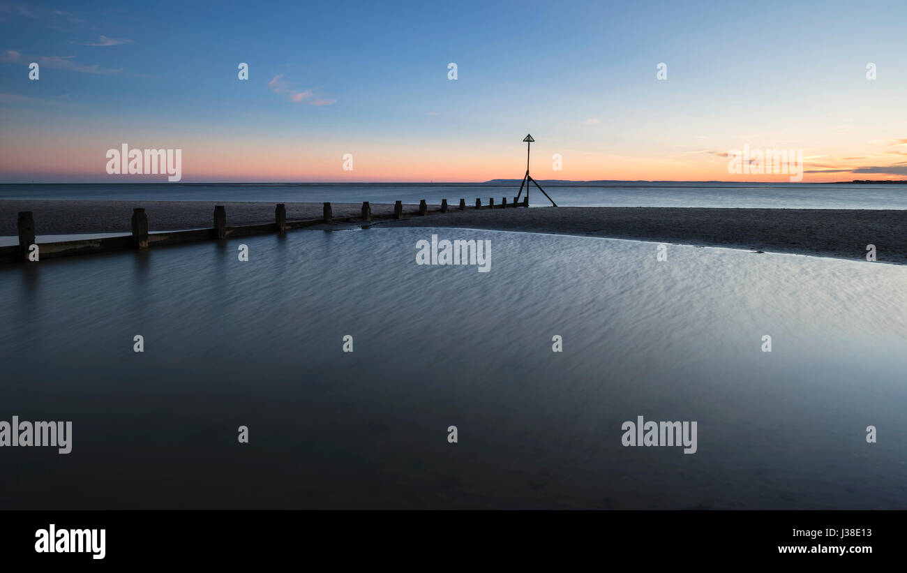 Beautiful Spring sunset long exposure beach landscape Stock Photo - Alamy