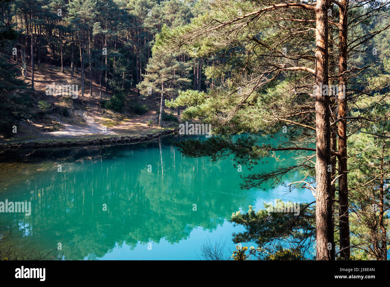 Beautiful landscape image of old clay pit quarry lake with unusual ...