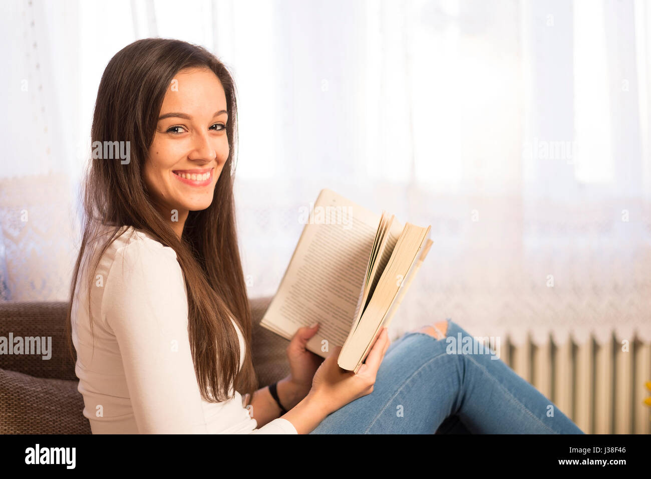 Woman reading a book Stock Photo - Alamy