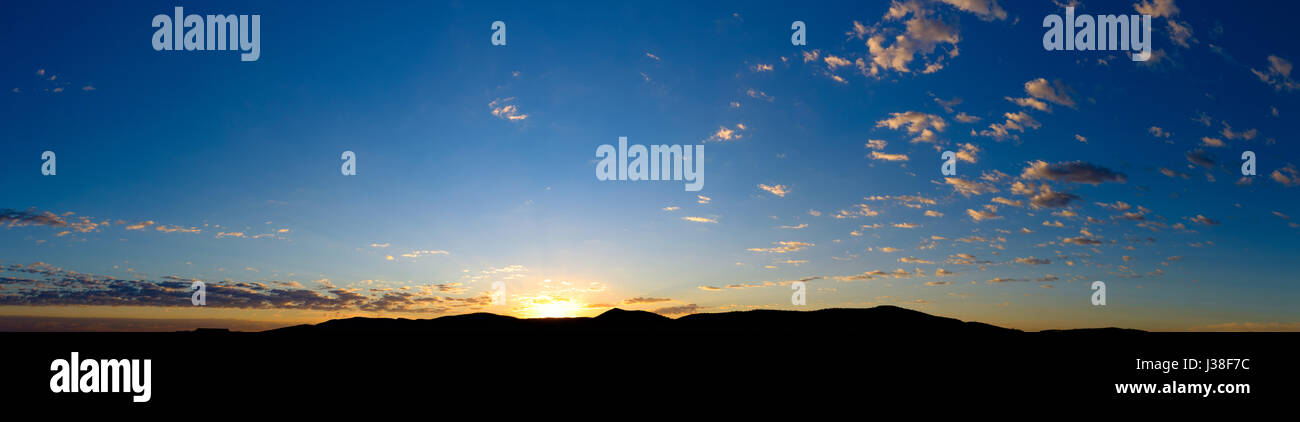Panoramic wide view of wide blue sky at sunrise with clouds Stock Photo ...