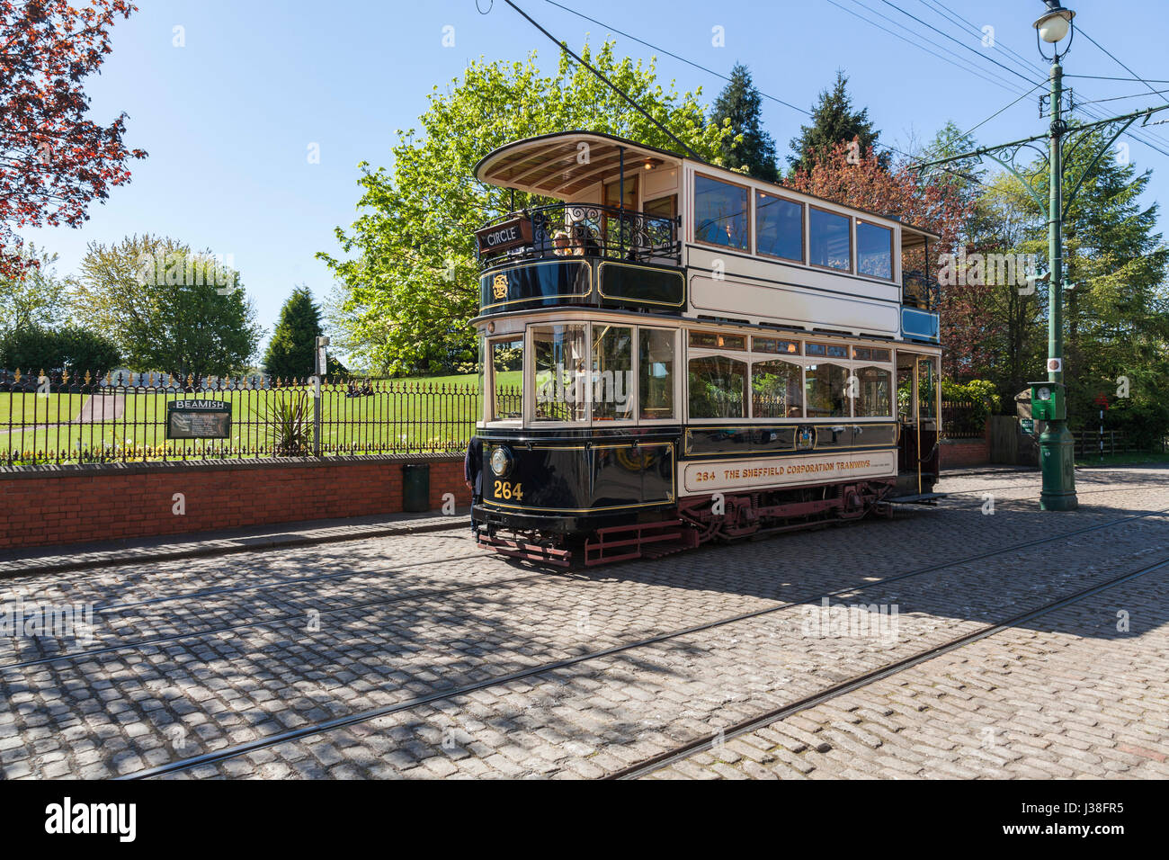 A tram parked outside a park area at Beamish Museum,Co.Durham,England ...