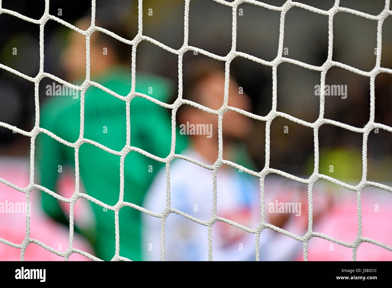 Goal net with soccer players in the background during the italian serie ...