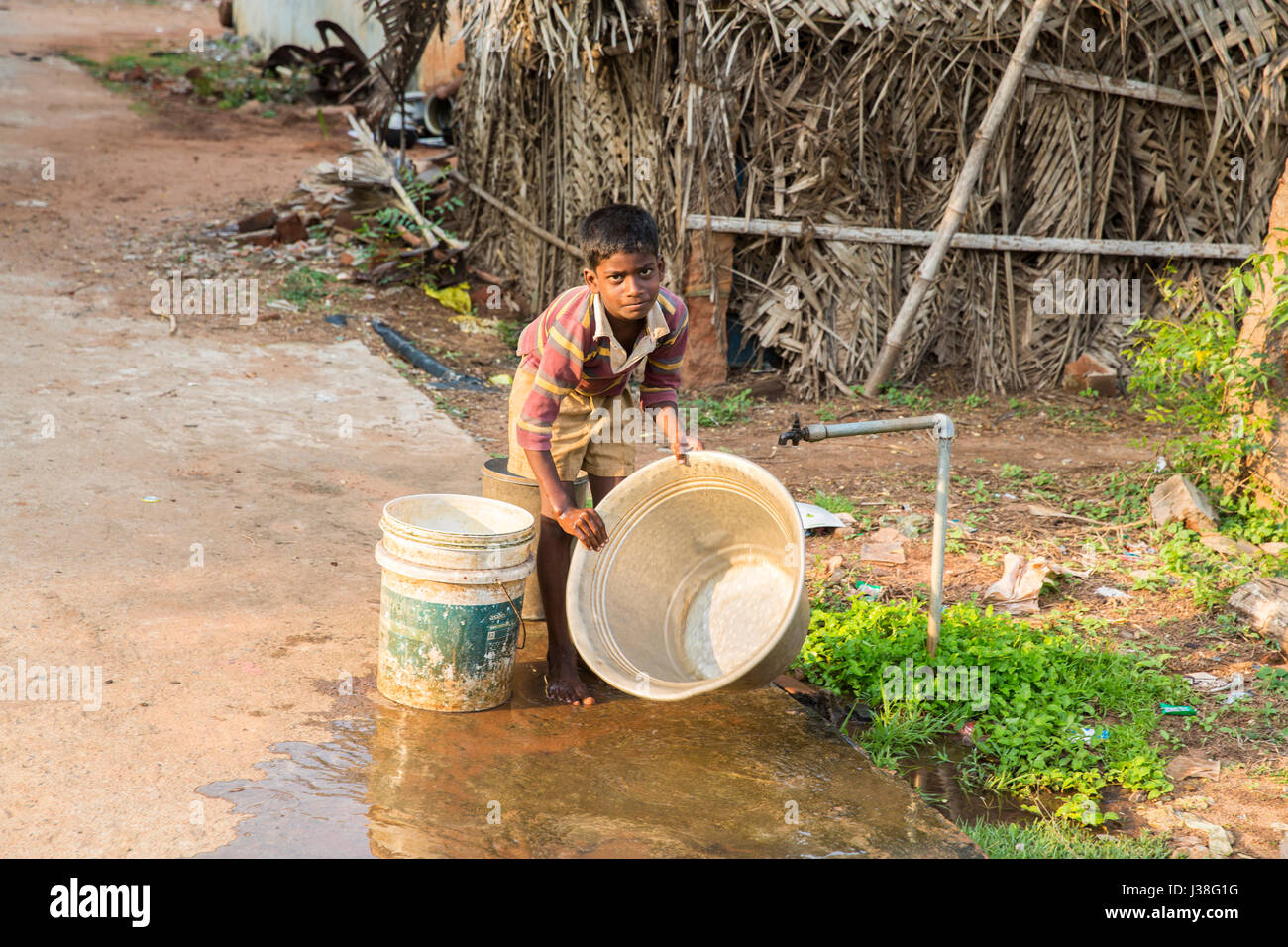 Poor indian boy washing hi-res stock photography and images - Alamy