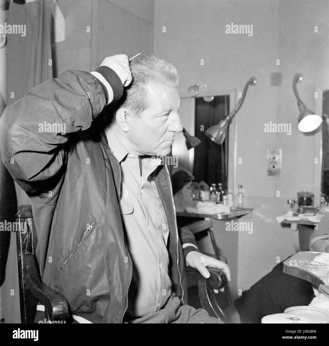 French actor Jean Gabin during a make-up session on the set of a film ...
