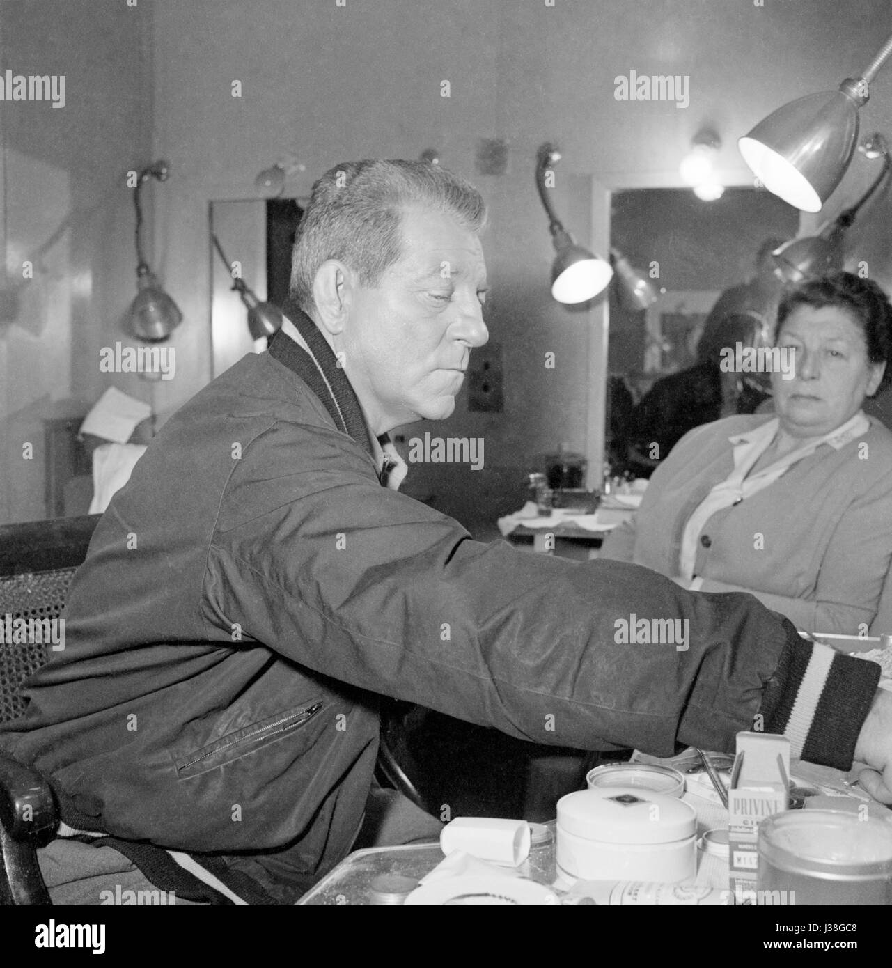 French actor Jean Gabin during a make-up session on the set of a film ...