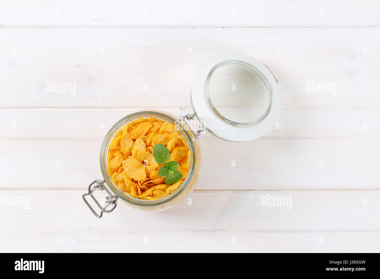 jar of corn flakes on white background Stock Photo - Alamy