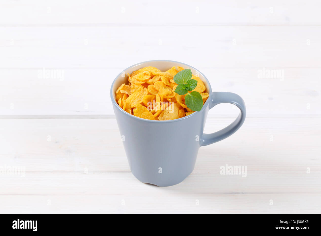 cup of corn flakes on white background Stock Photo - Alamy