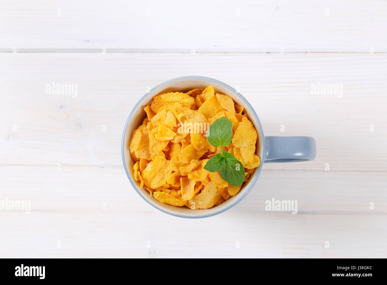 cup of corn flakes on white background Stock Photo - Alamy