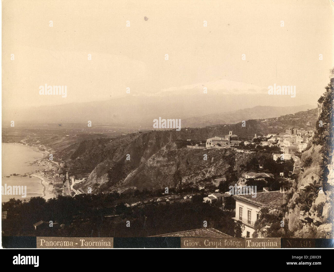 Giovanni Crupi's 'Panorama Taormina' (1900) depicts a panoramic view of ...
