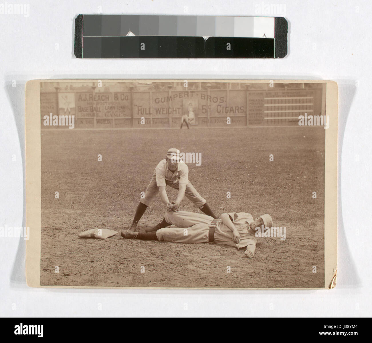 The photograph of Charlie Bastian and Denny Lyons captures two notable ...