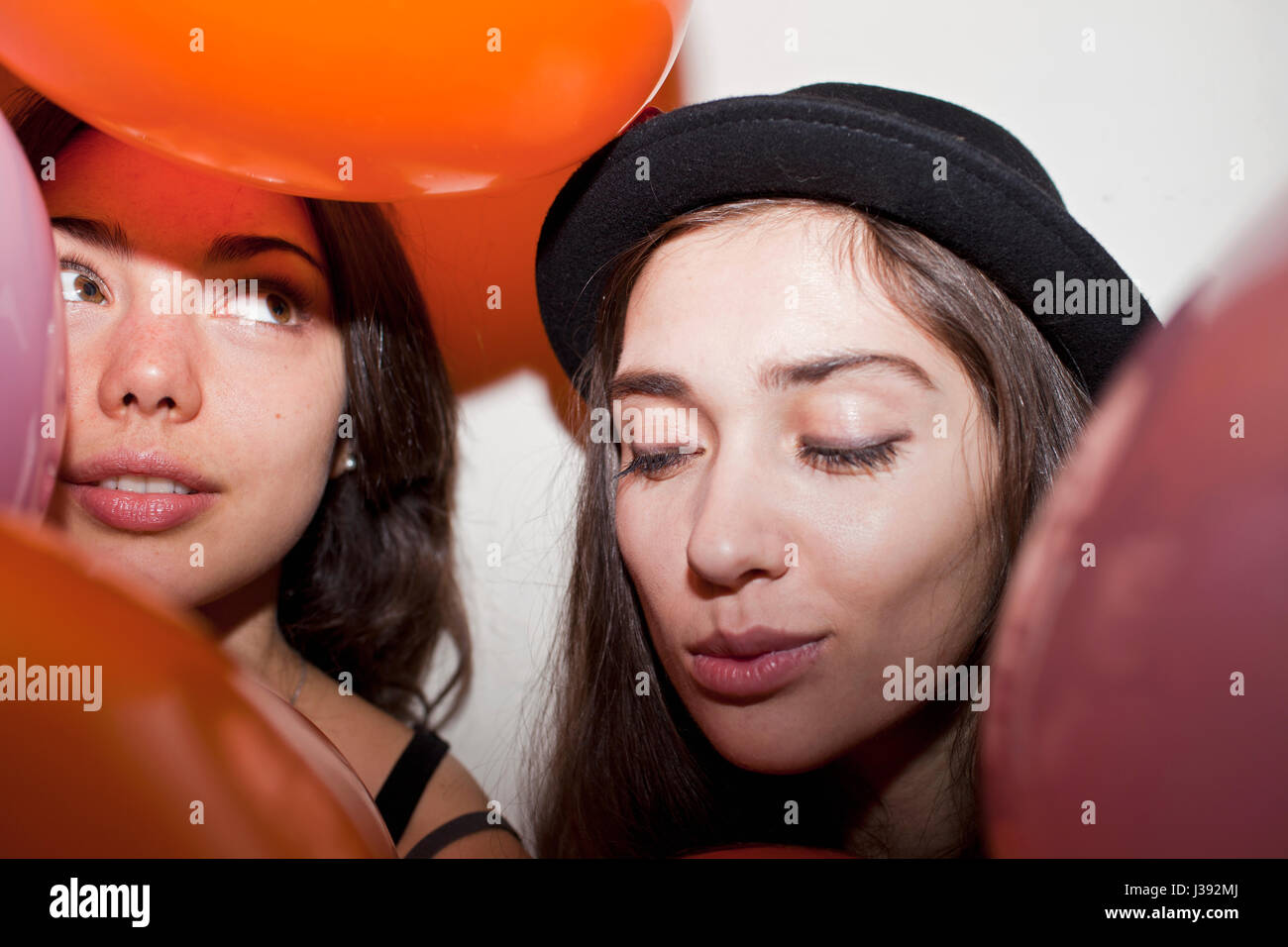 Friends hanging out at a party Stock Photo - Alamy