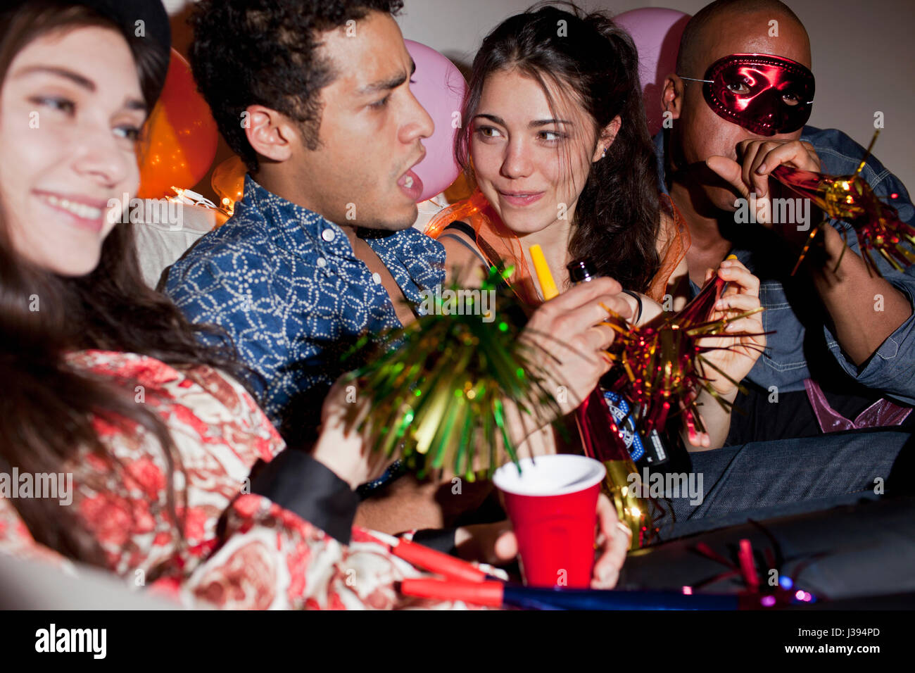 Friends hanging out at a party Stock Photo - Alamy