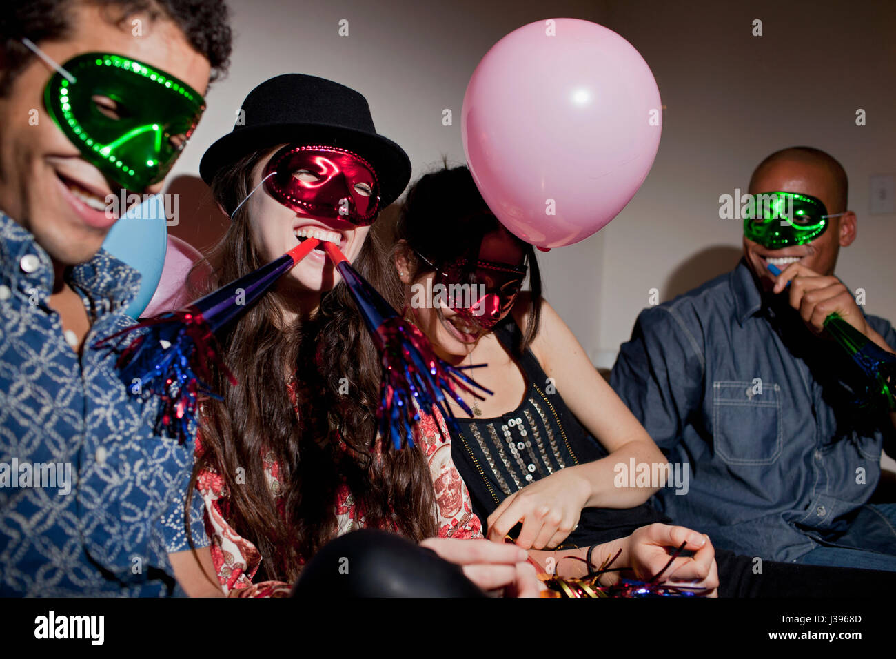 Friends hanging out at a party Stock Photo - Alamy