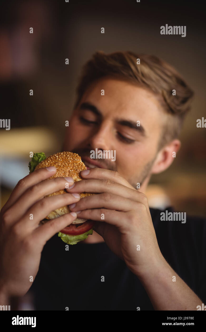 Man eating burger hi-res stock photography and images - Alamy