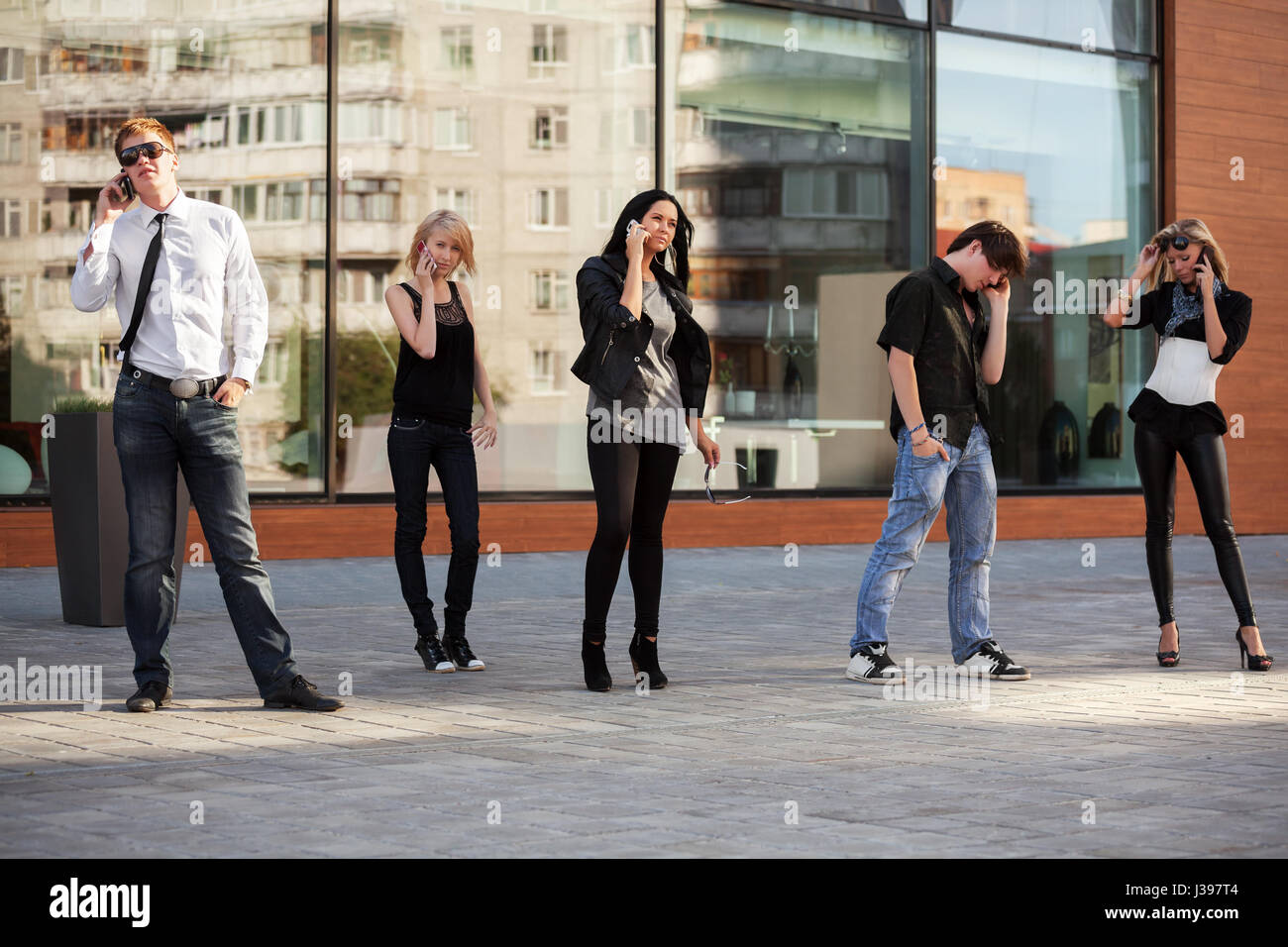 Young people calling on the cell phones Stock Photo - Alamy
