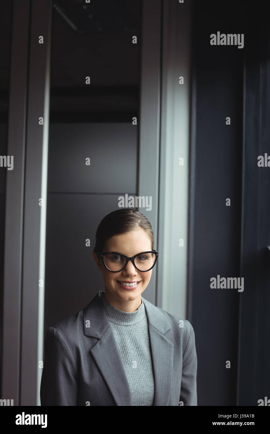 Portrait of smiling counselor in office Stock Photo - Alamy