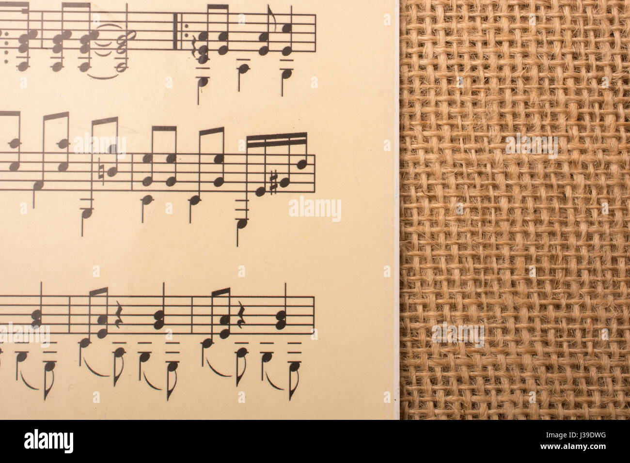 Musical notes on paper placed on a linen canvas Stock Photo - Alamy