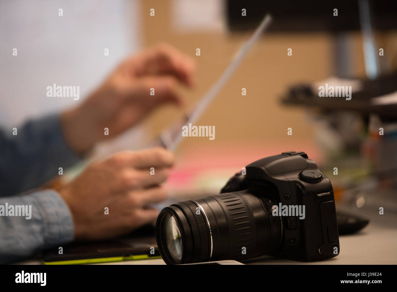 Close up of camera on desk by photographer in creative office Stock ...