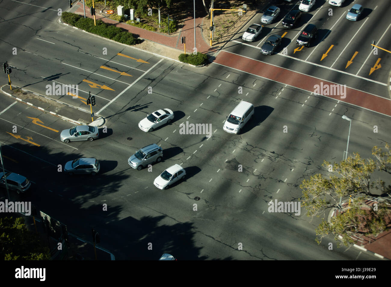 High angle view of road intersection in city on sunny day Stock Photo ...
