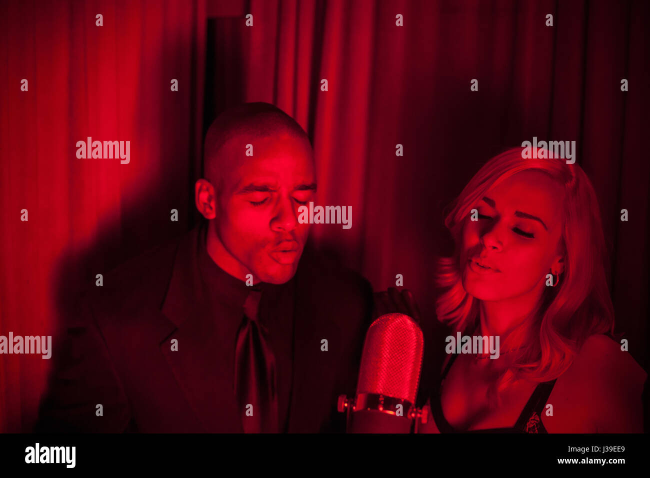 Young singers performing in a nightclub Stock Photo - Alamy