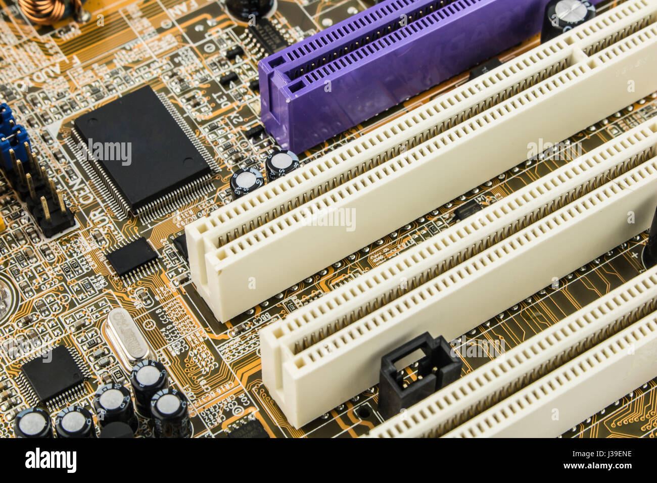 Chip and slots on the motherboard of the computer close Stock Photo - Alamy