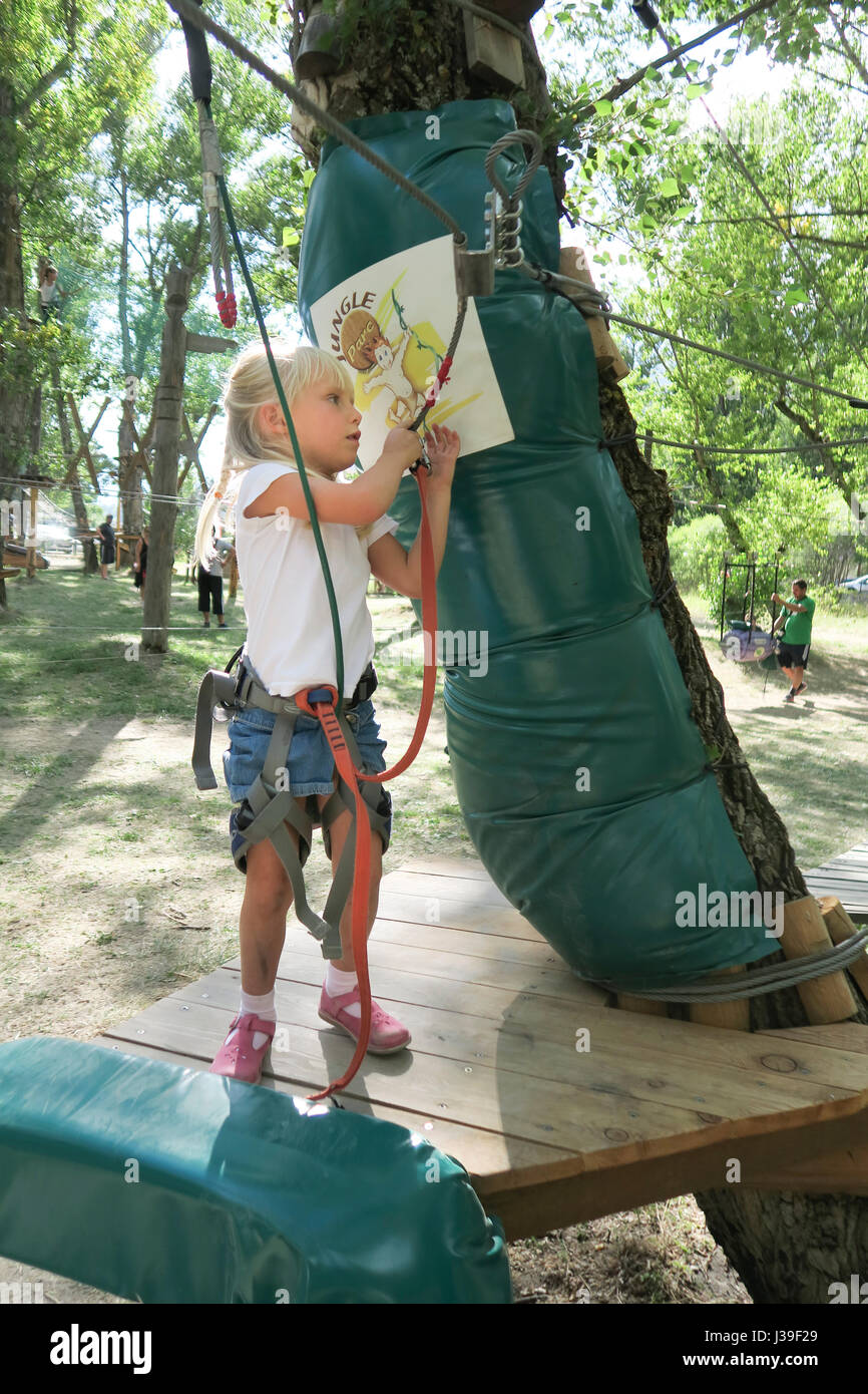 Year old girl climbing tree hi-res stock photography and images - Alamy