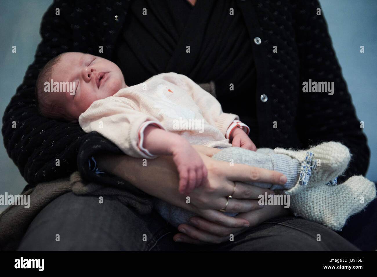 New parents sitting newborn baby hi-res stock photography and images ...