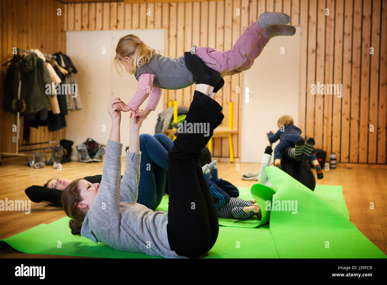 MOTHER AND CHILD PRACTICING YOGA Stock Photo - Alamy