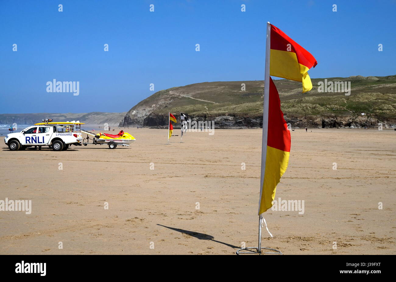 Newquay, Cornwall, UK - April 7 2017: Warning flags on the beach for ...