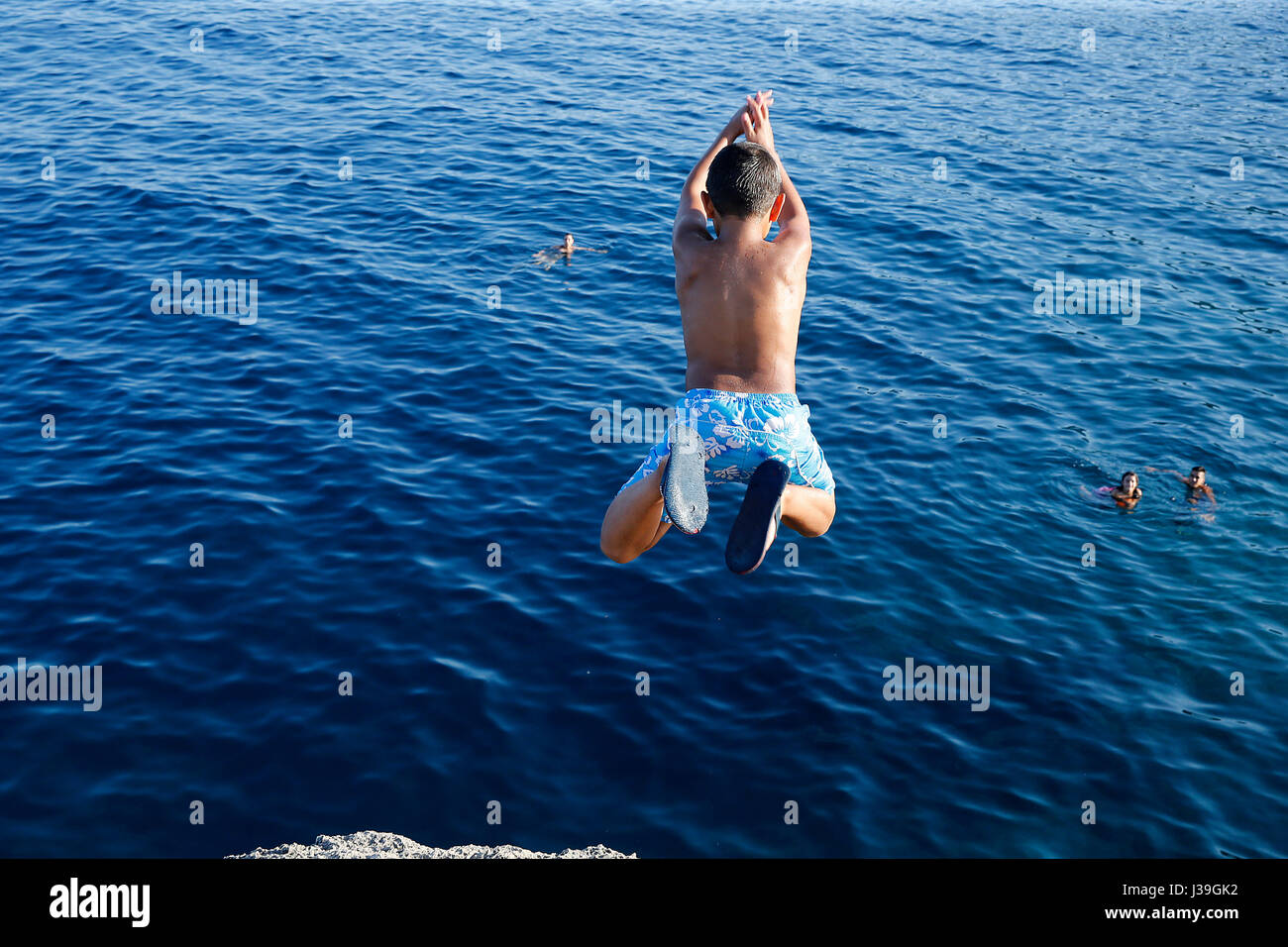 Boy Diving In To Sea Stock Photos & Boy Diving In To Sea Stock Images ...
