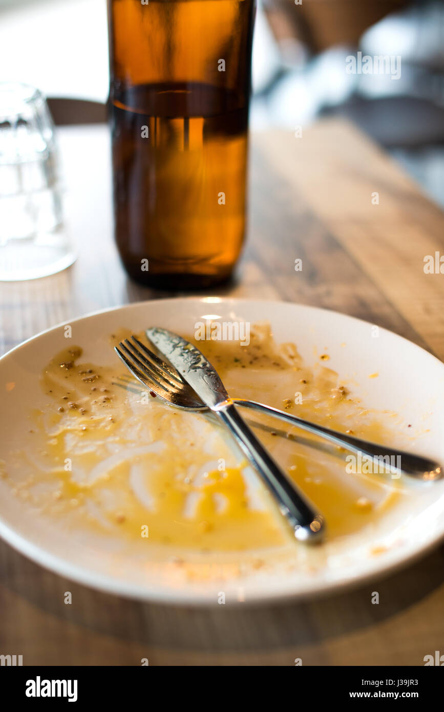 empty plate left after dinner Stock Photo - Alamy