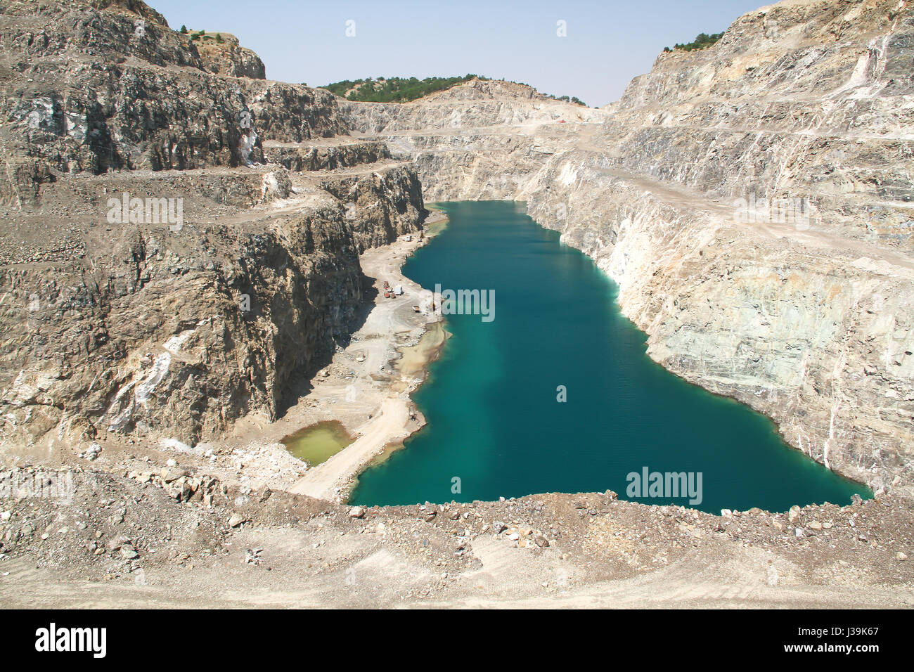 Open pit mine with lake Stock Photo - Alamy