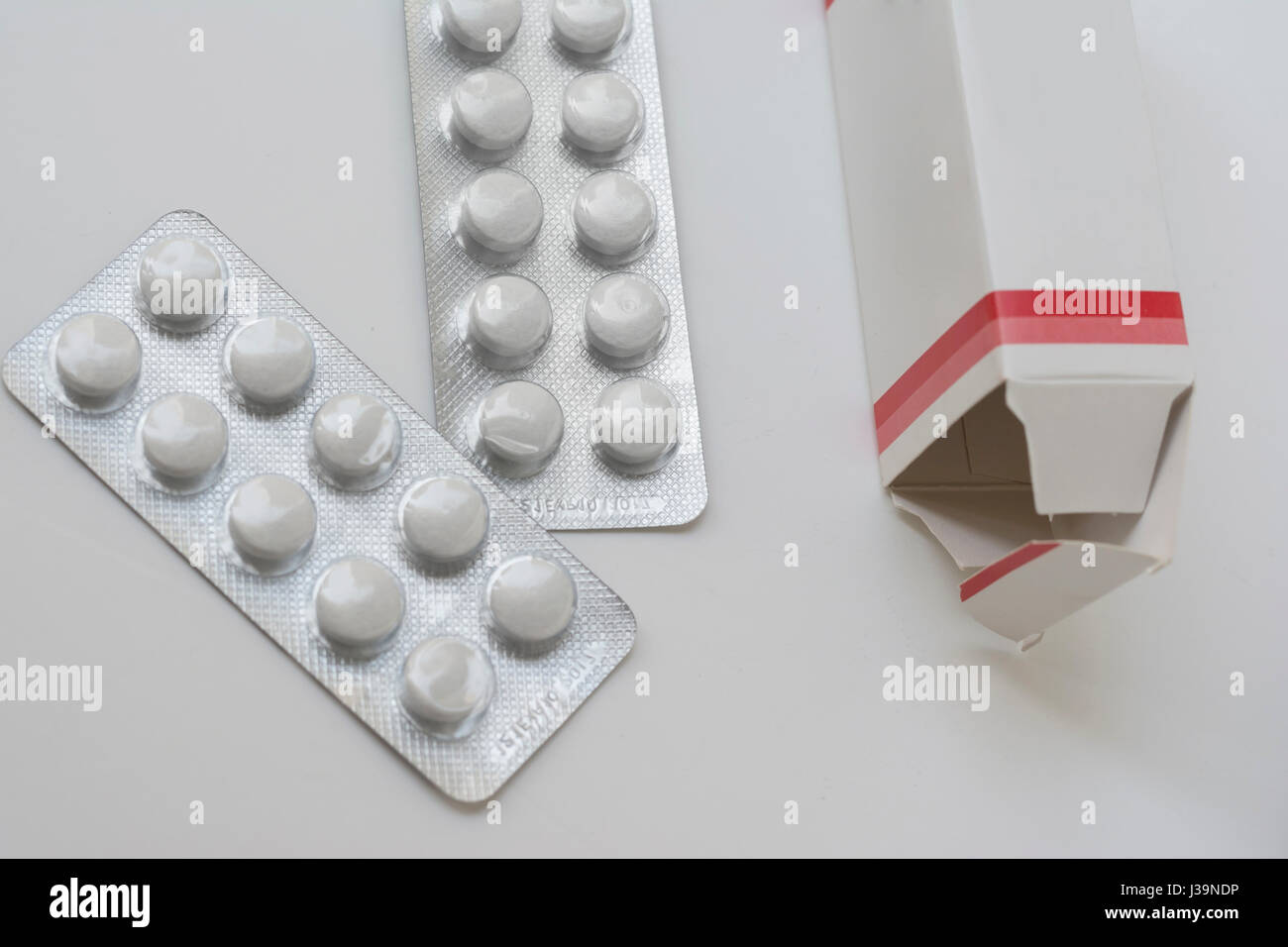 Multiple Loafs of Tablets Out Form the Box over gray background with ...