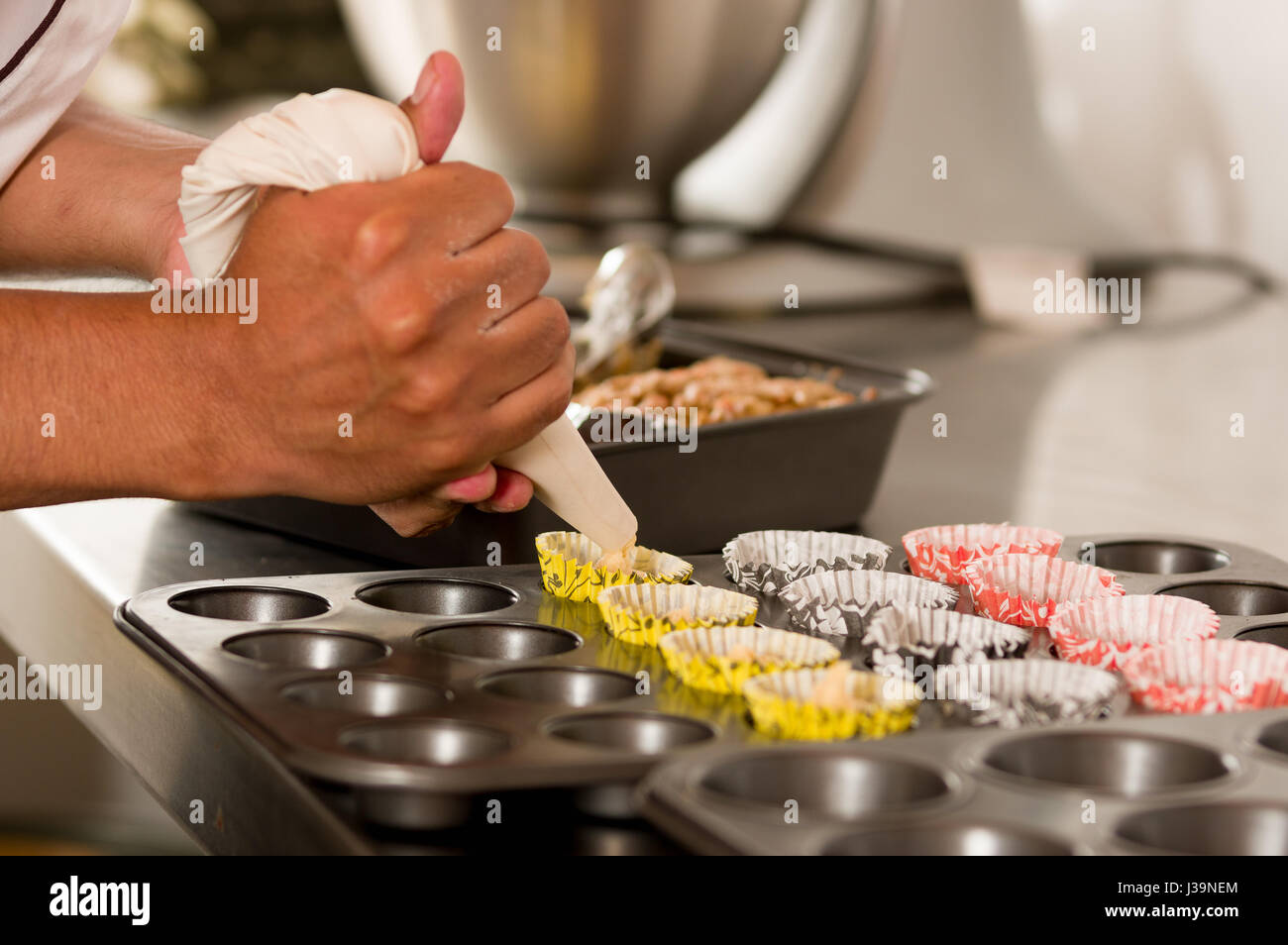 A bakery man is preparing a delicious christmas cookies in a bakery ...