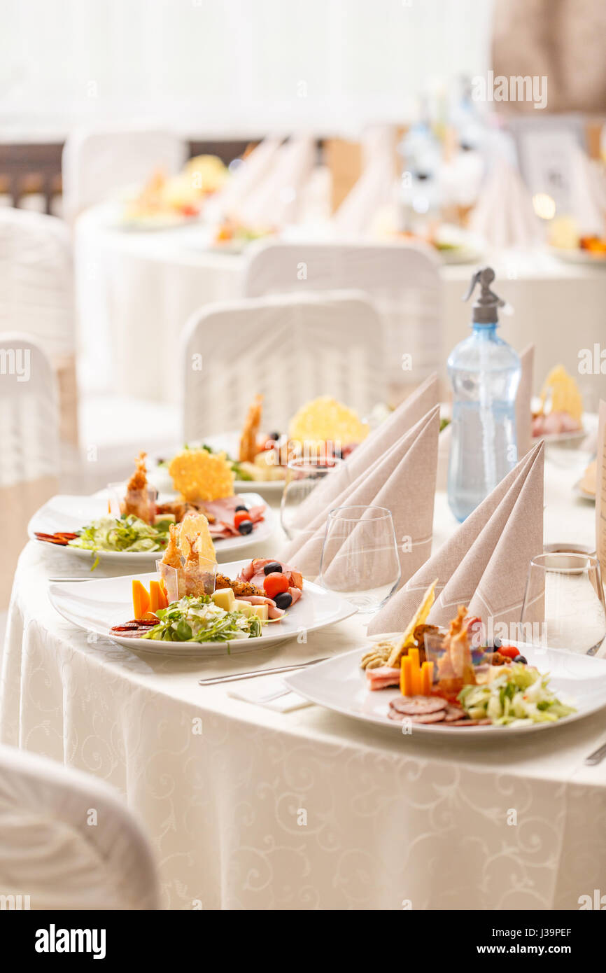 Delicious appetizer plates served on restaurant table Stock Photo - Alamy